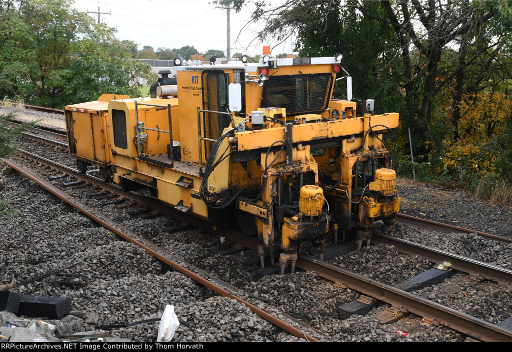 TX 801 works the ballast west of the Route 202 railroad overpass